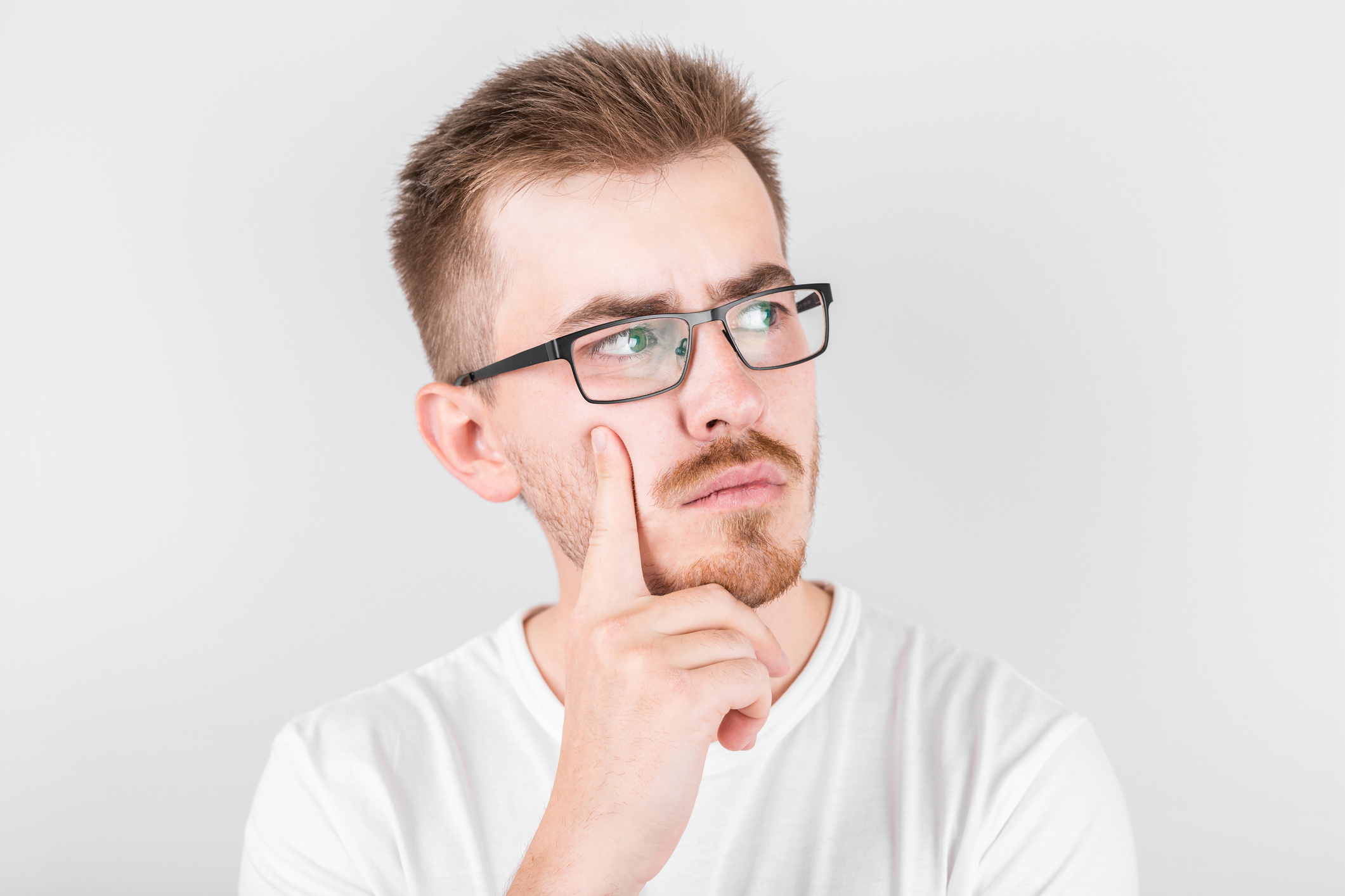 Photo of thoughtful man isolated over white background wall. Looking ... Photo of thoughtful man isolated over white background wall. Looking ...